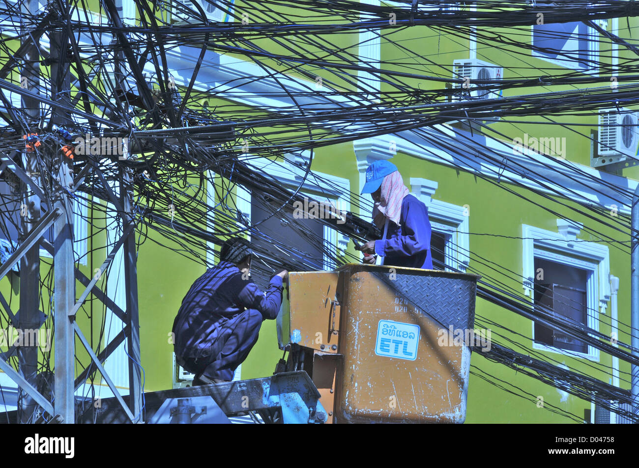 men working on phone lines Vientiane Laos Stock Photo - Alamy