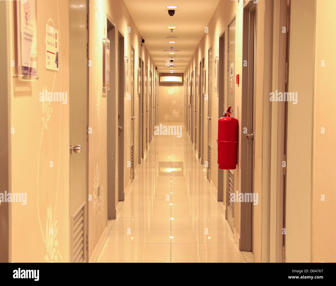 Corridor with fire extinguisher and CCTVs. Concept of public safety ...