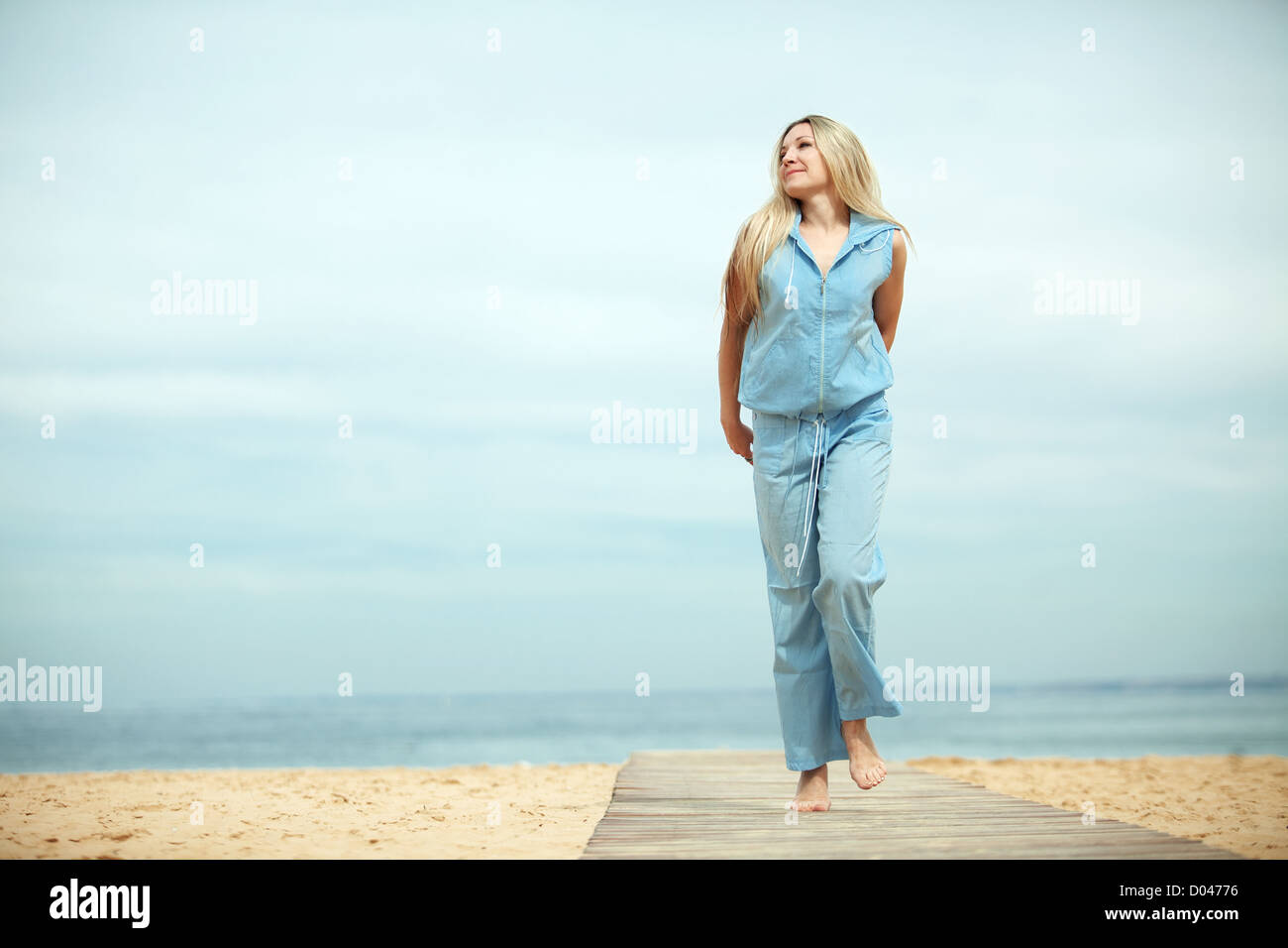 Woman resting at the beach Stock Photo - Alamy