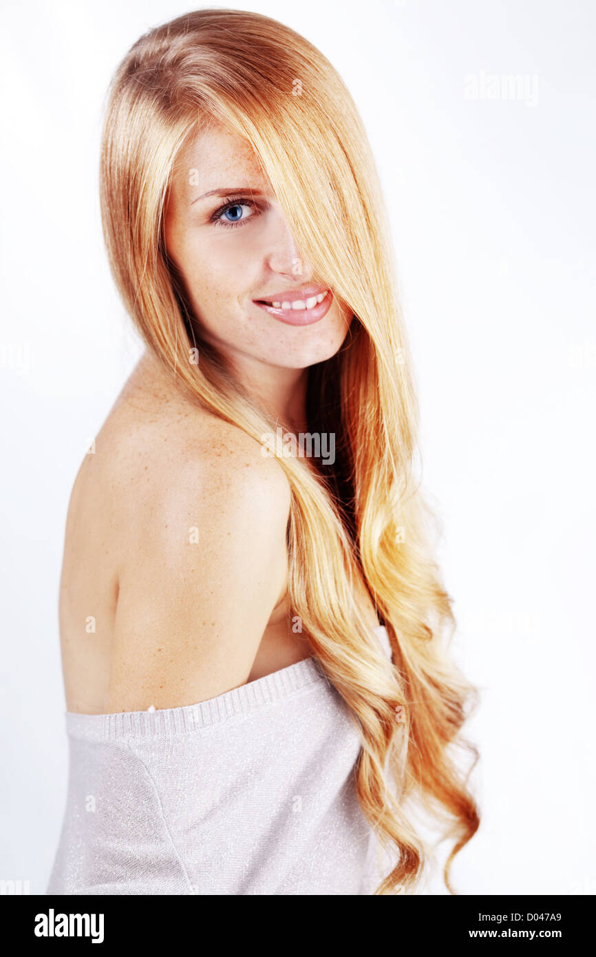 Studio of beautiful young woman with long gold hair Stock Photo - Alamy