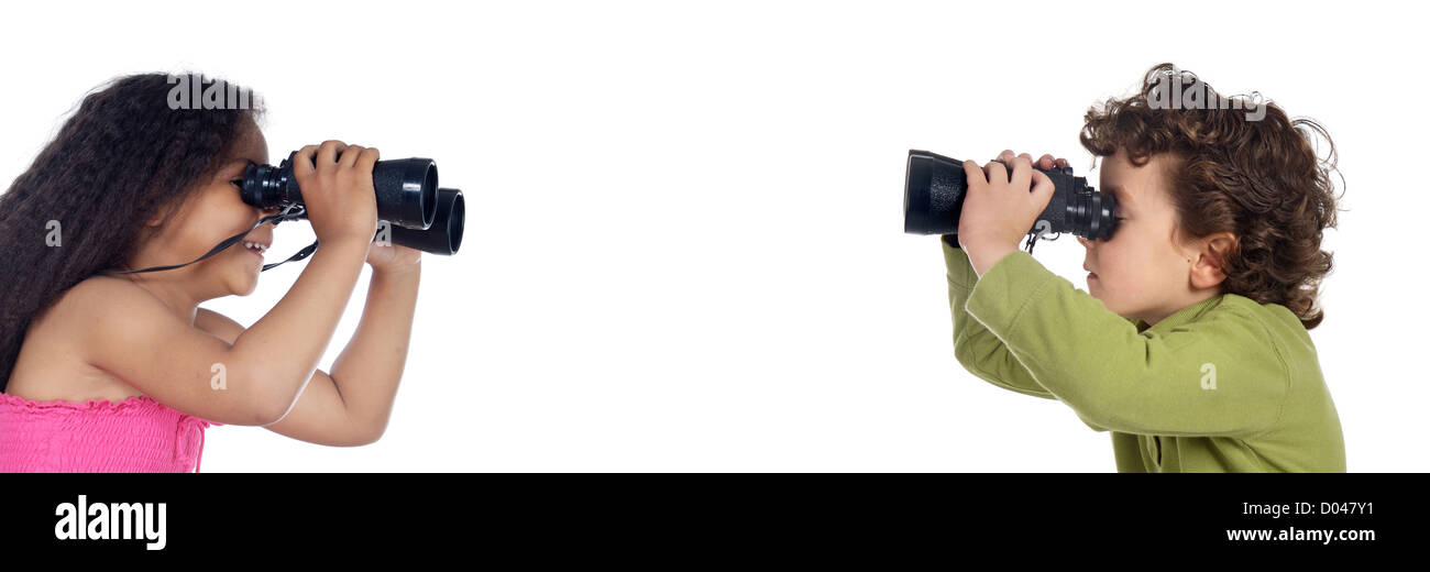 Two children looking through the binoculars a over white background Stock Photo - Alamy