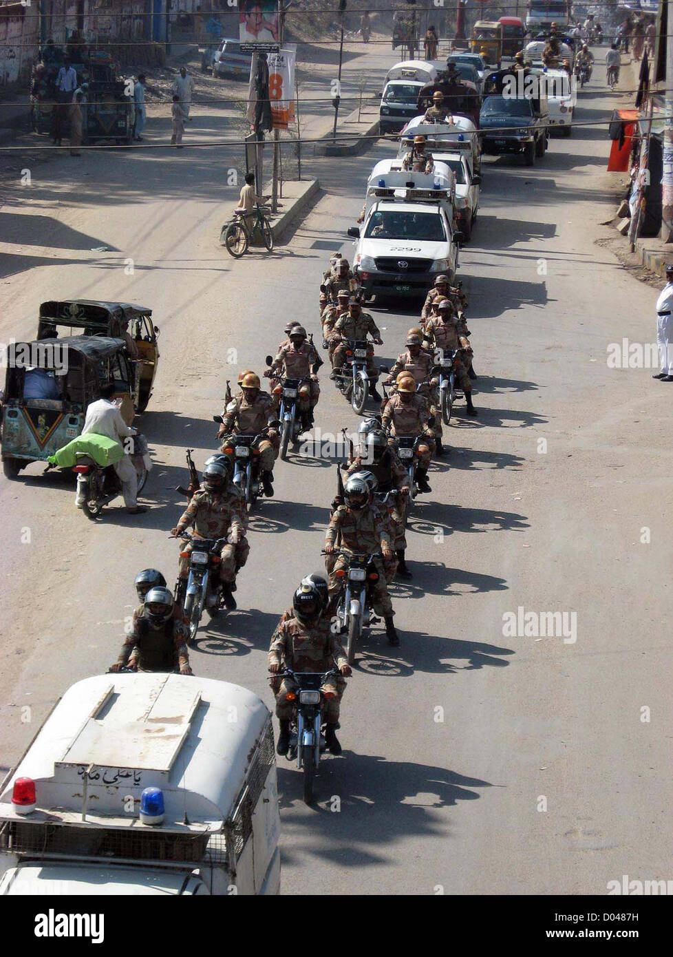 Rangers and police convoy patrols in city during flag march to maintain ...