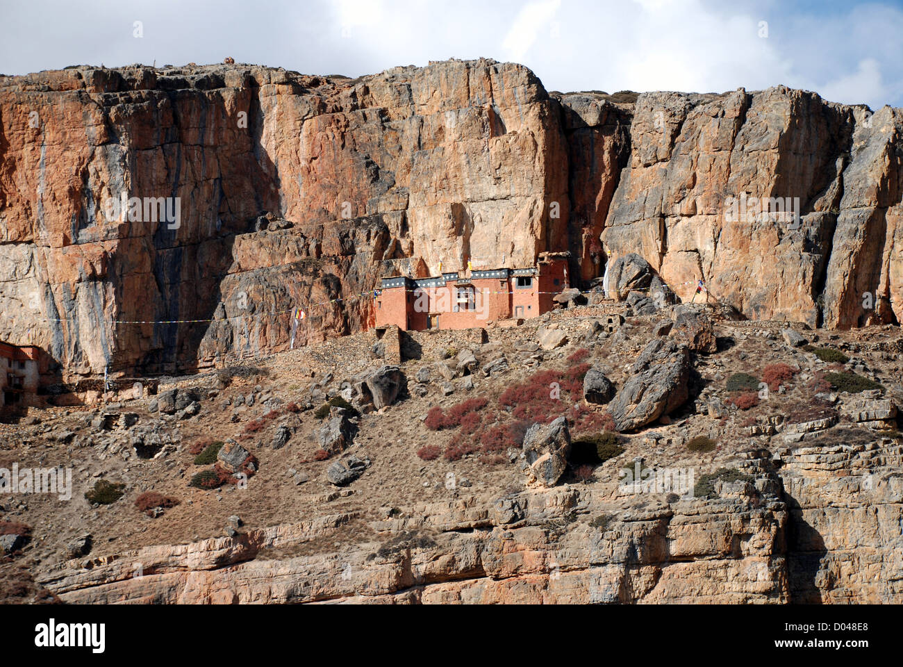 The Buddhist Monastery at Kagyupa sits on a high ledge in the mountains ...