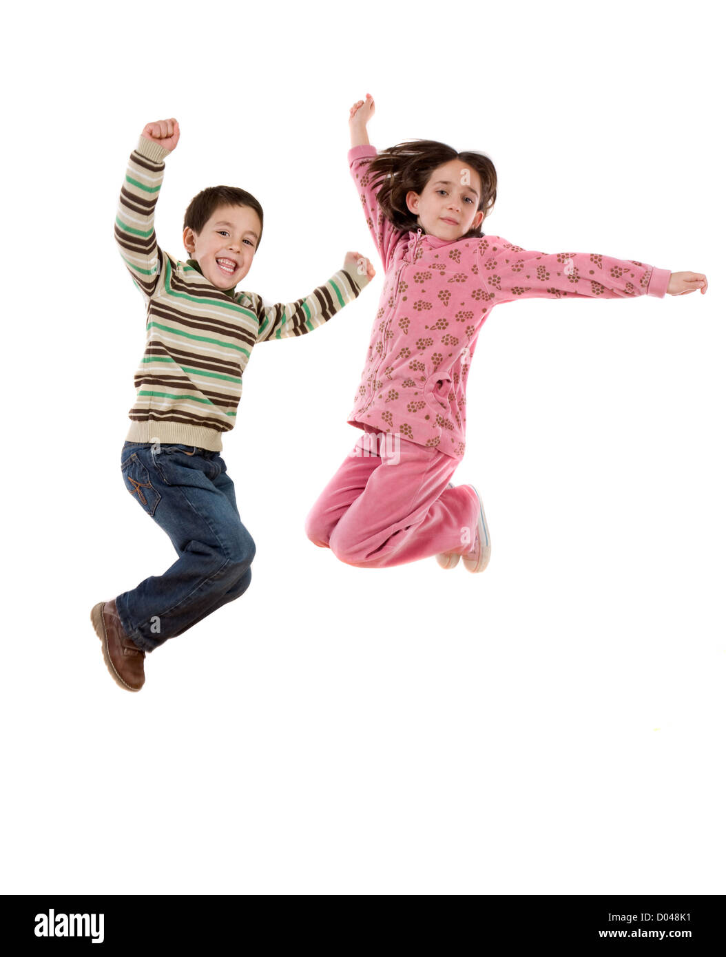 Two happy children jumping at once on a white background Stock Photo ...