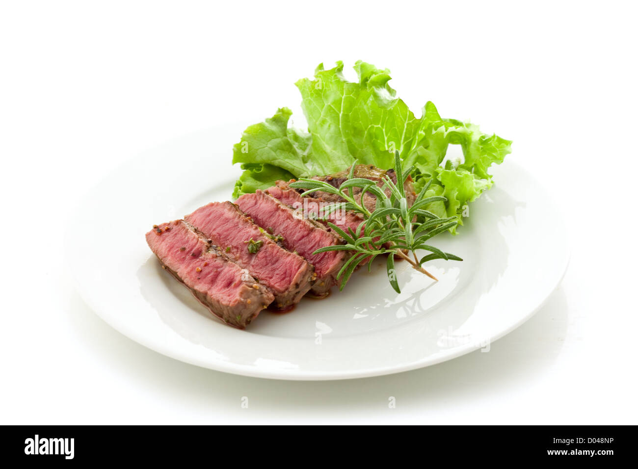 photo of delicious and pefect cooked beaf steak with rosemary and ...