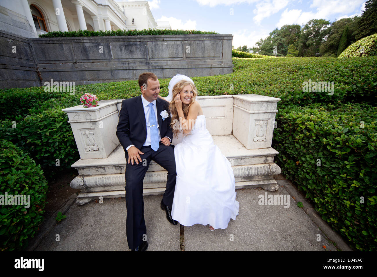 Happy bridal couple enjoying their wedding day park hi-res stock ...