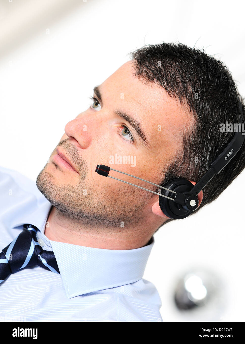 beautiful man is calling by headphone Stock Photo - Alamy
