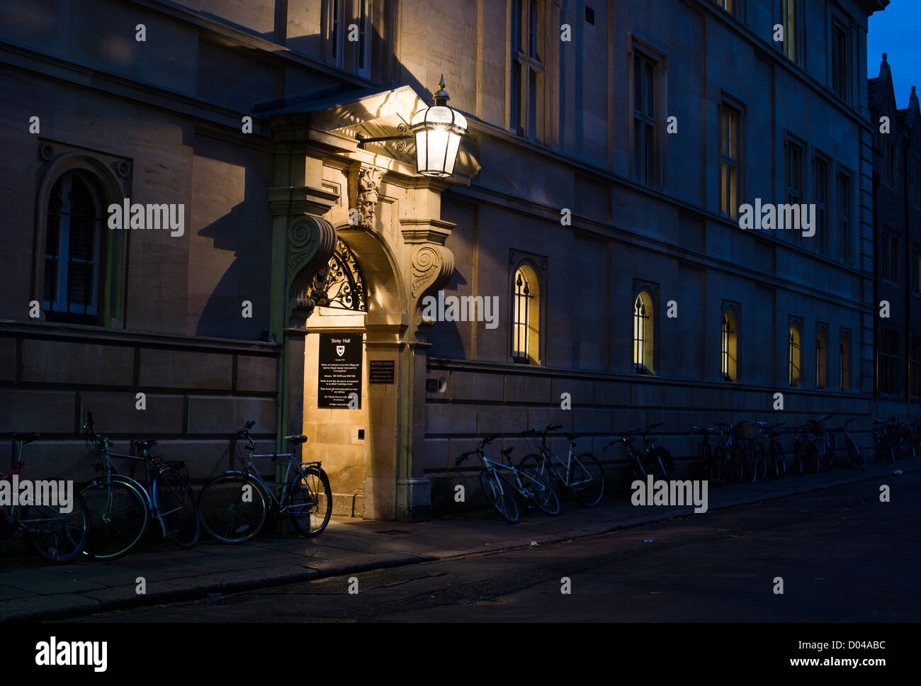 Lit entrance to Trinity Hall college, Cambridge, England, UK Stock ...