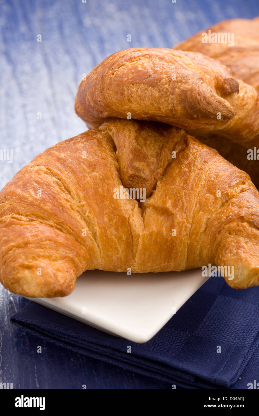 photo of delicious fresh croissants for breakfast on a soft blue ...