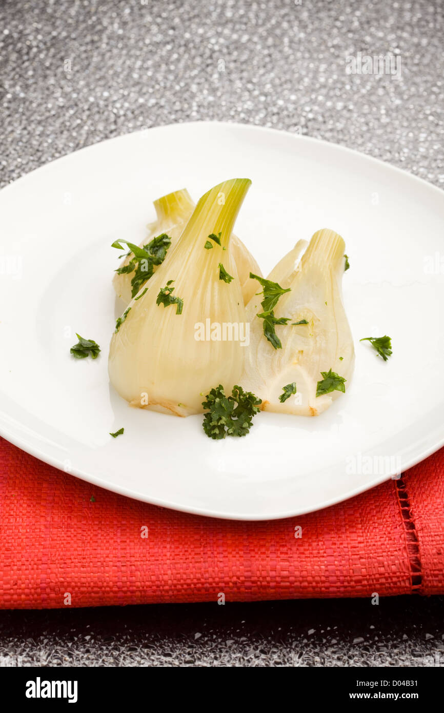 photo of cooked fennel with parley on a glass table Stock Photo - Alamy