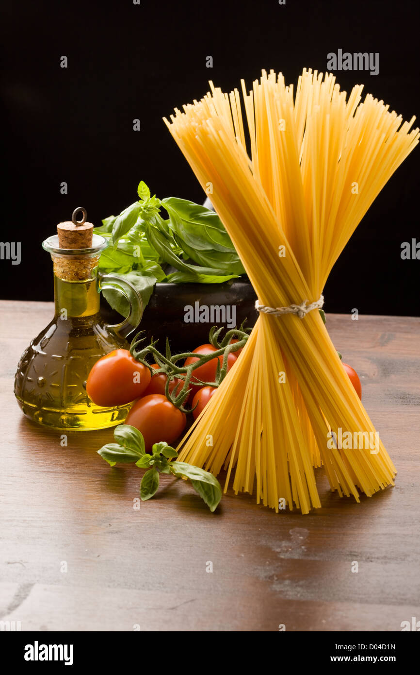 photo of different ingredients for italian pasta with tomatoes and ...