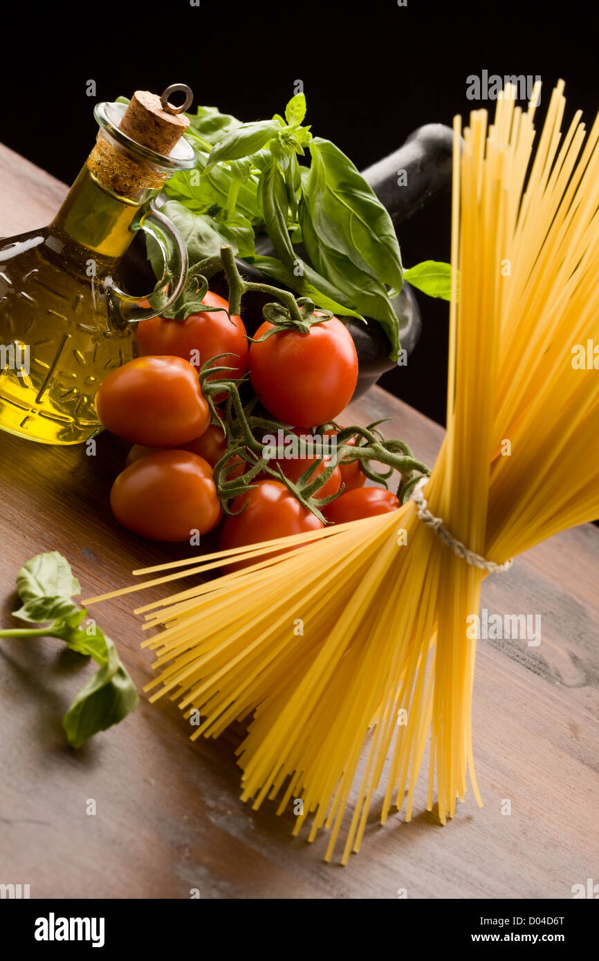 photo of different ingredients for italian pasta with tomatoes and ...