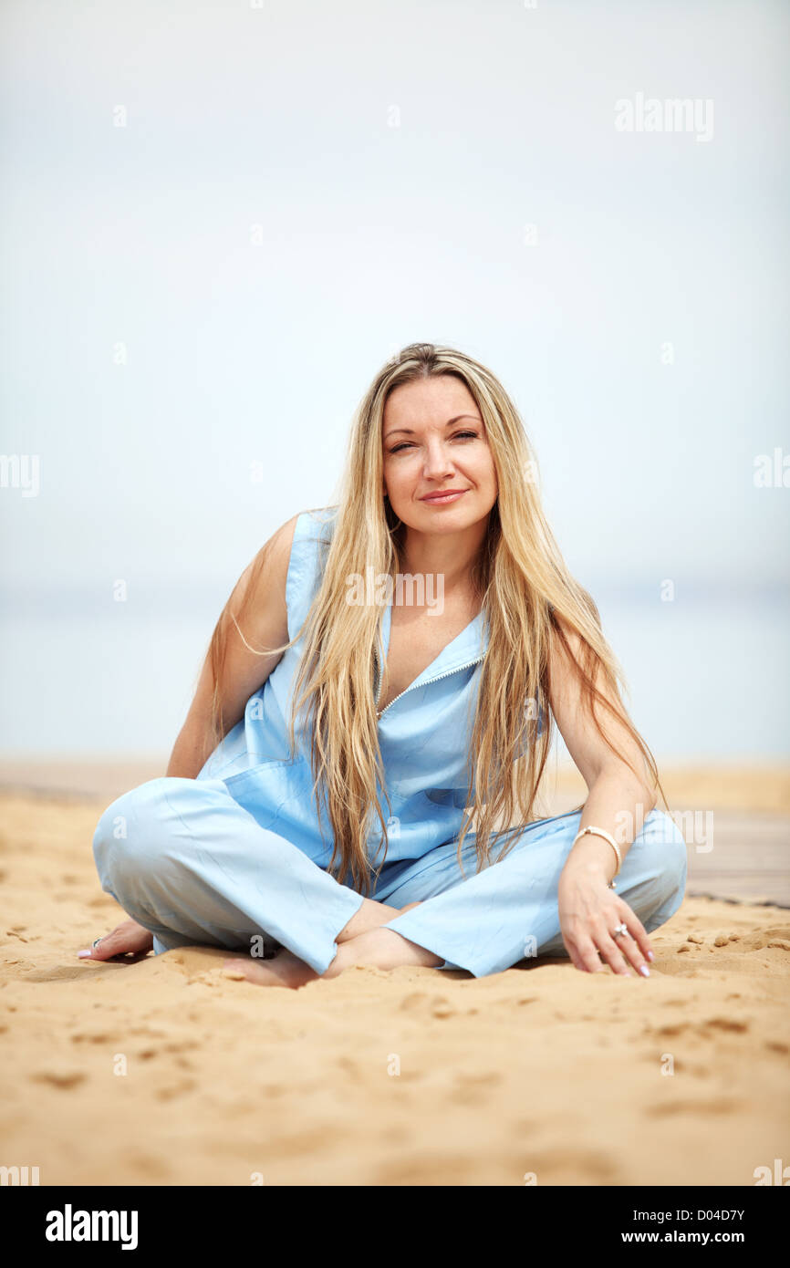 Woman resting at the beach Stock Photo - Alamy