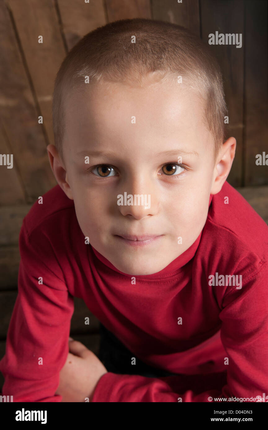 Portrait of a little boy in red, top view Stock Photo - Alamy