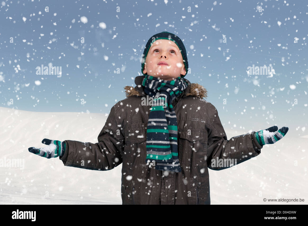boy looking up , snow falling down Stock Photo - Alamy