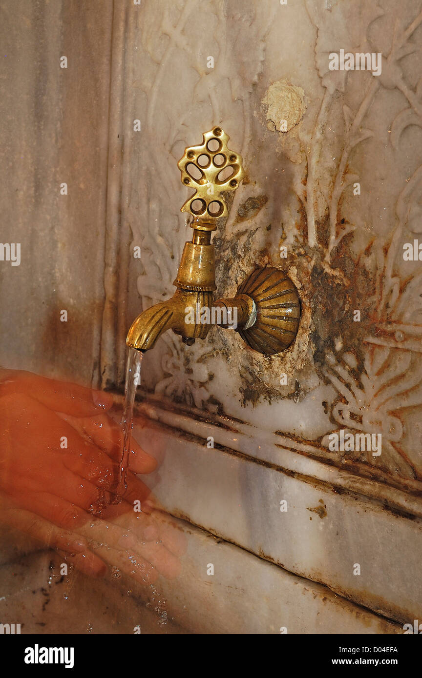 Man washing hands with holy water in the Blue Mosque Old Istanbul ...