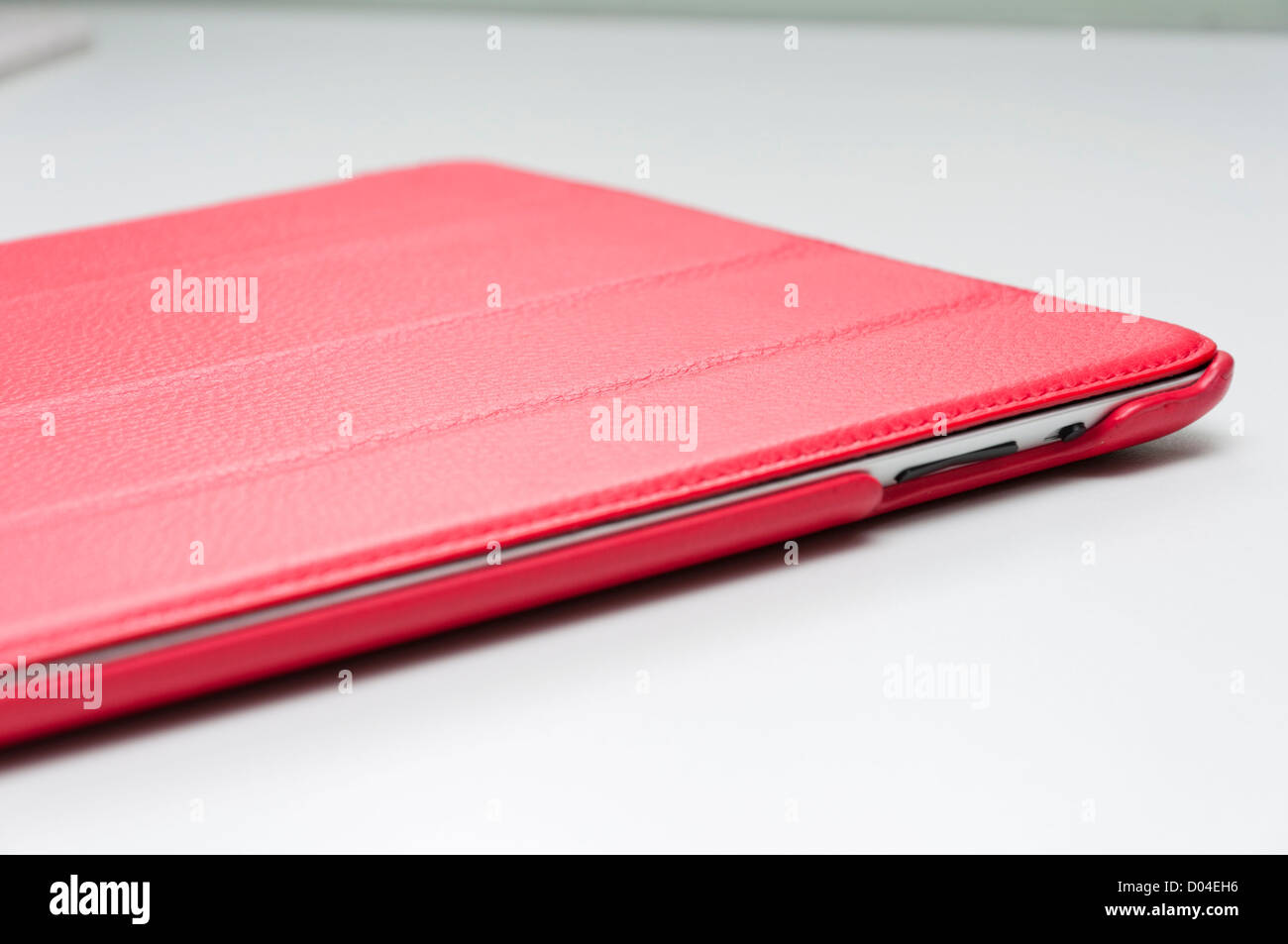 Ipad tablet computer in red cover case Stock Photo - Alamy