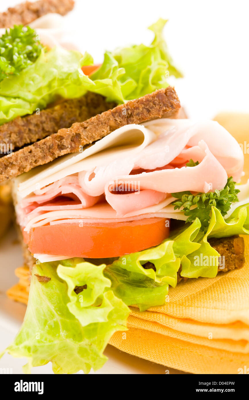 photo of delicious big cheese and ham sandwich with lettuce on white ...