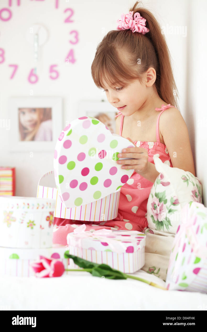 Kid girl with gift boxes Stock Photo - Alamy