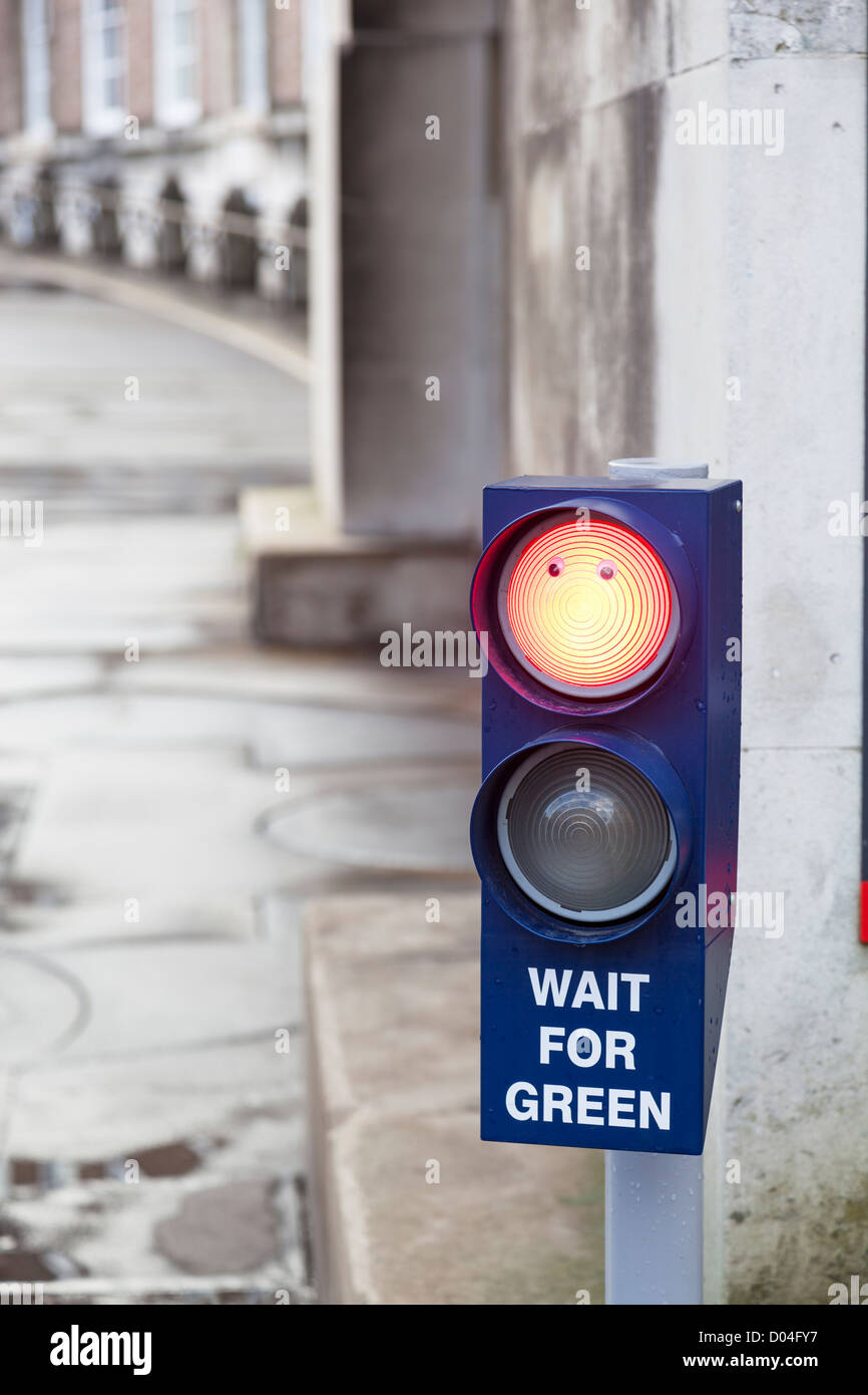 Small traffic light on red Stock Photo - Alamy