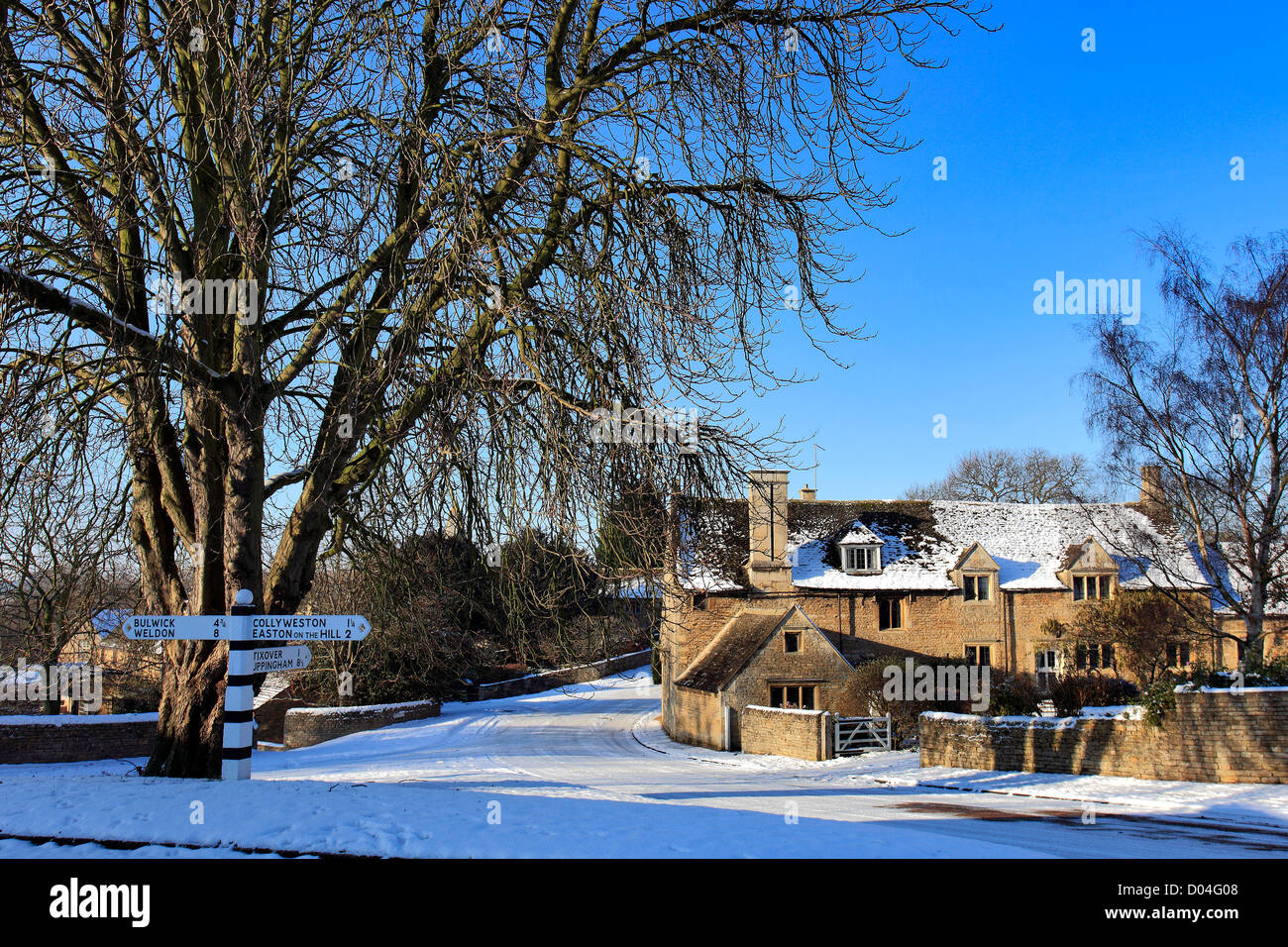 A snowy winter scene over Duddington village, Northamptonshire England ...