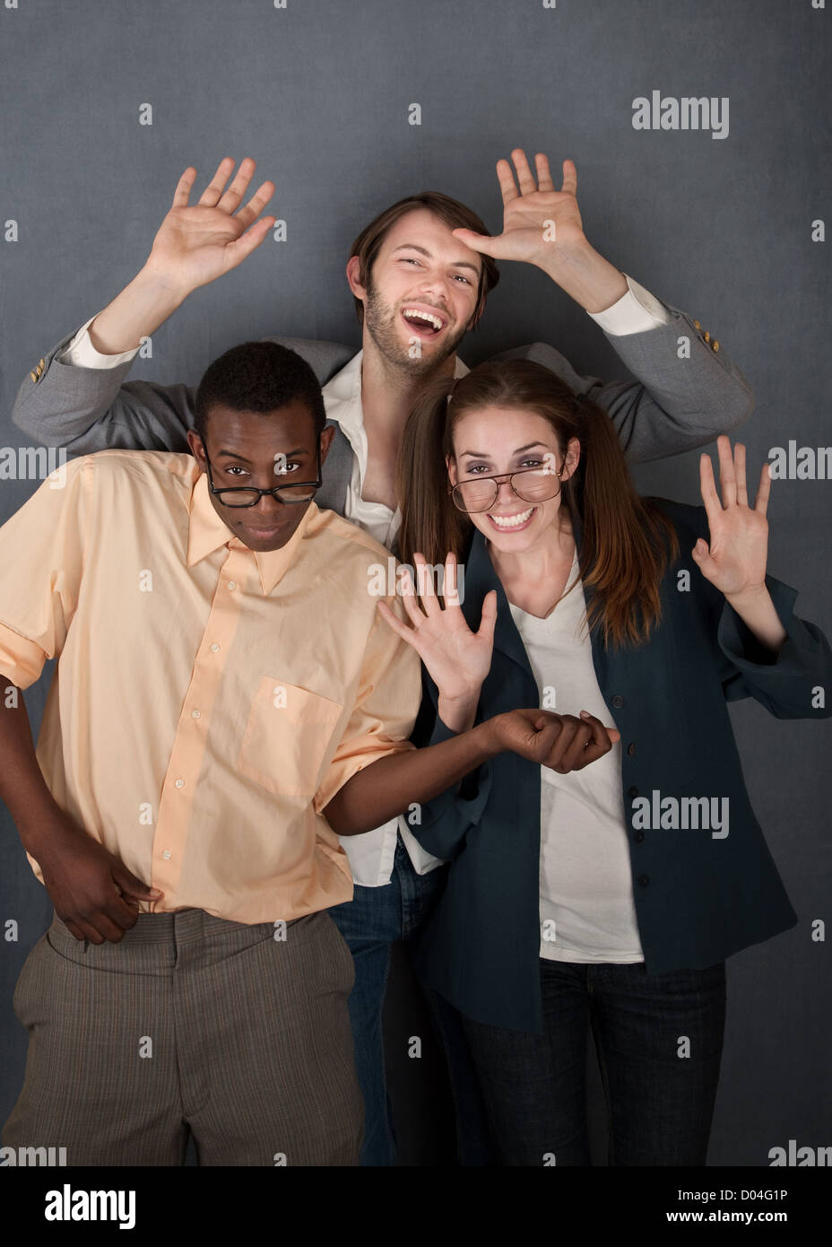 Female and male geek dance while a slick salesman waves Stock Photo - Alamy