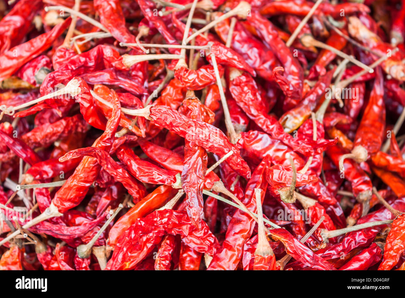 Dried red pepper on display at local market Stock Photo - Alamy