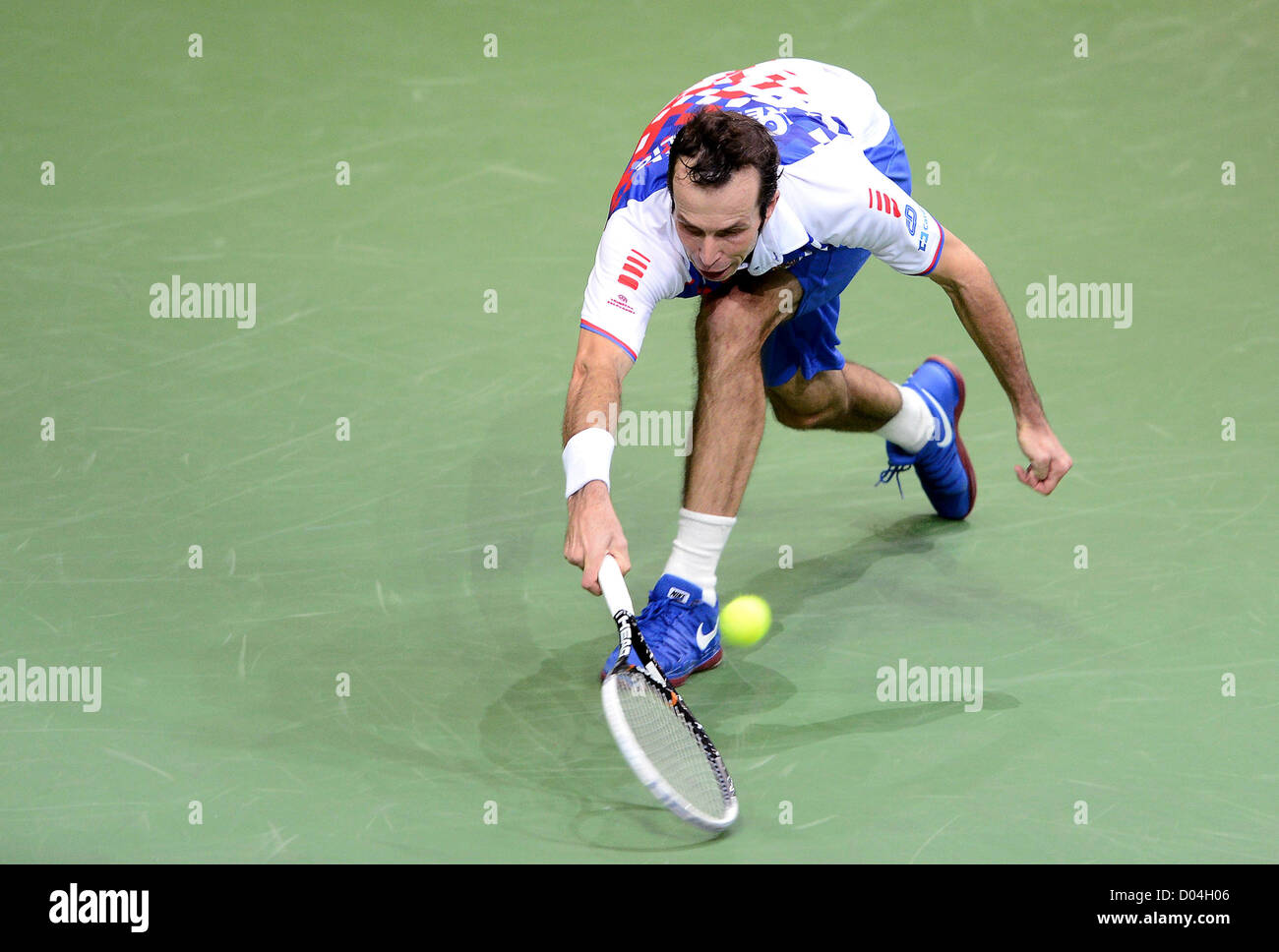 Radek Stepanek of Czech Republic returns a ball to Spain's David Ferrer ...