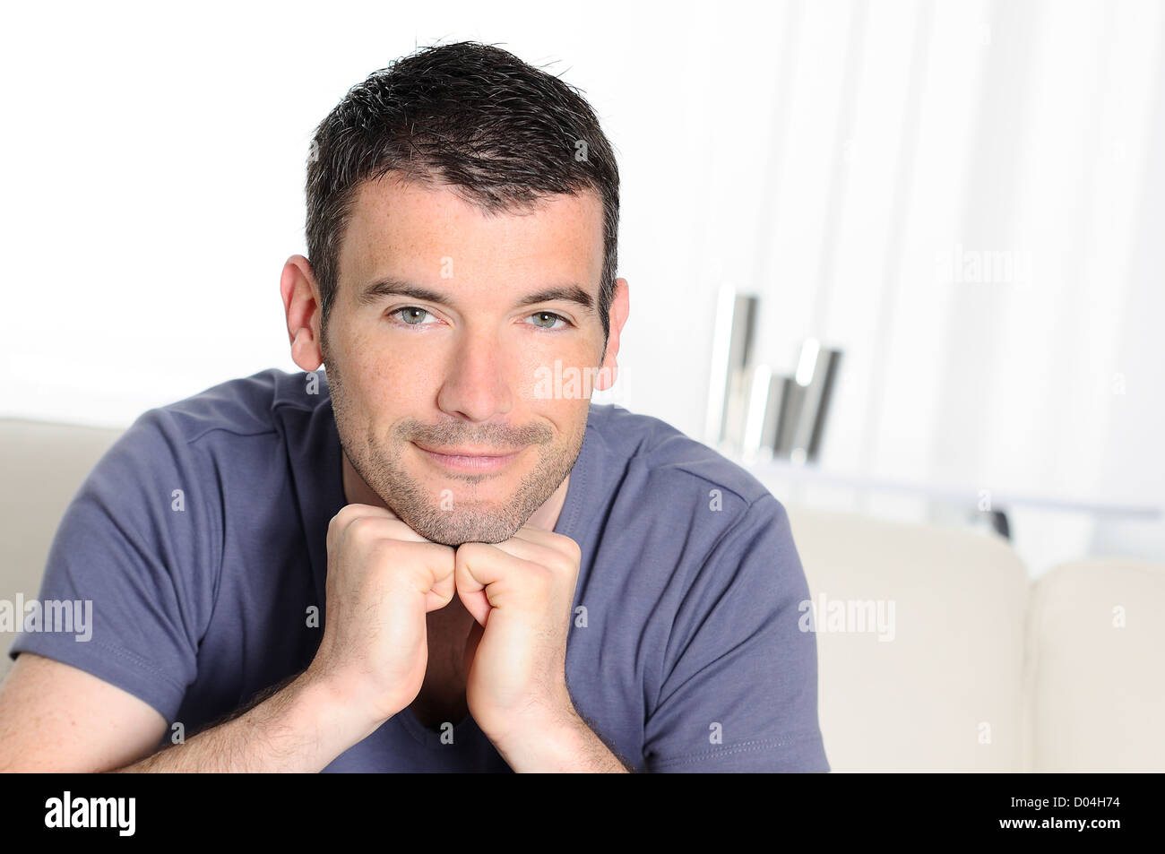 natural and relaxed looking young man Stock Photo - Alamy