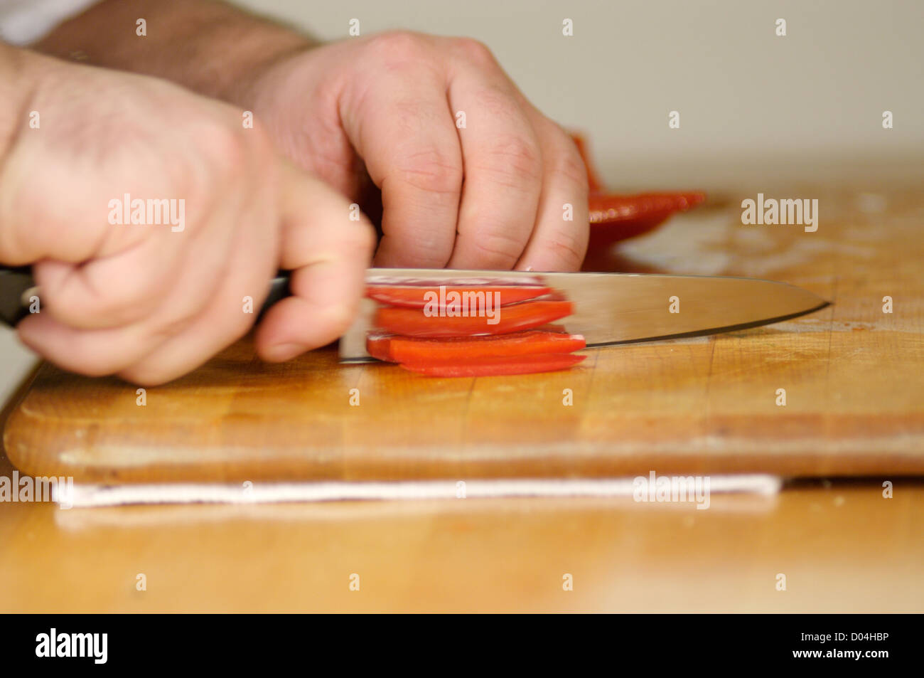 Hand chopping food Stock Photo - Alamy