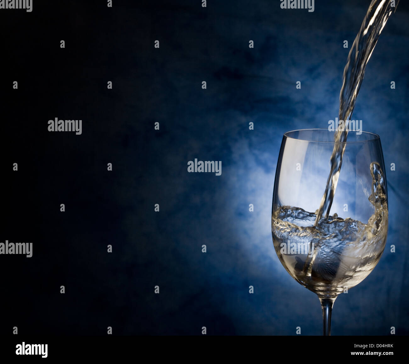Photo of white wine inside a wine glass with abstract background Stock ...