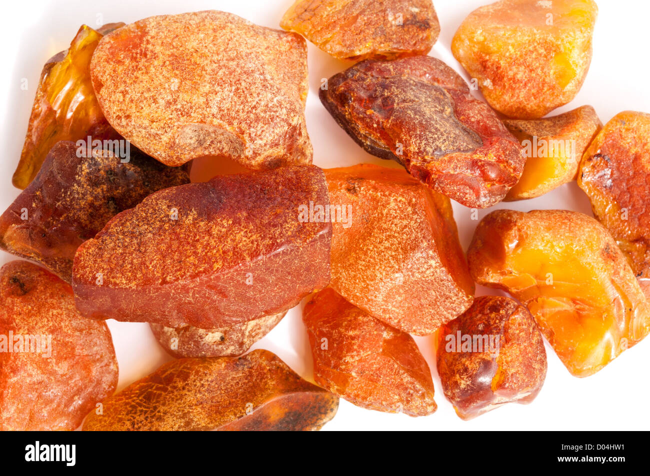 Baltic amber stone on white background Stock Photo - Alamy