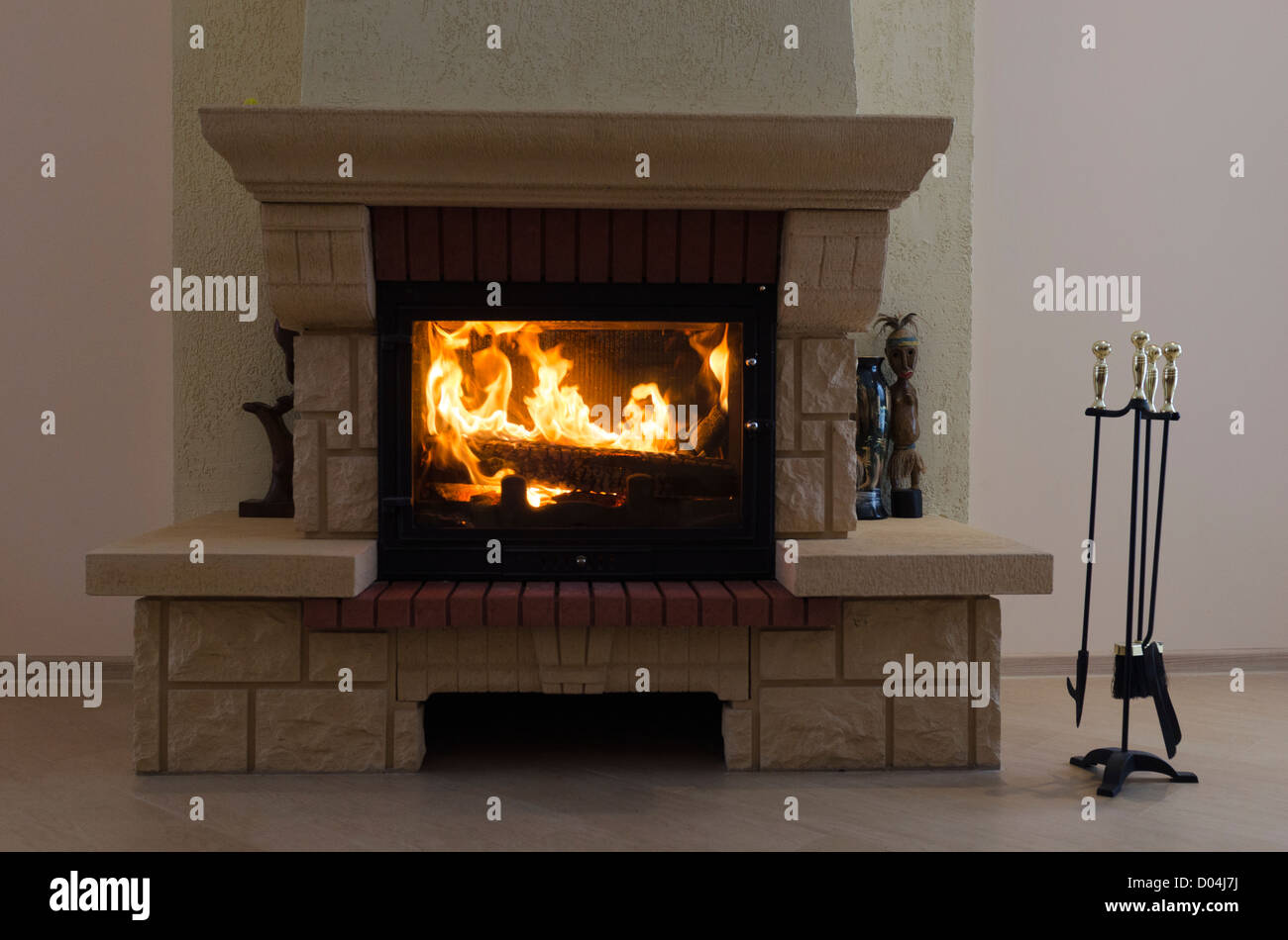Fireplace at modern home with set fire Stock Photo - Alamy
