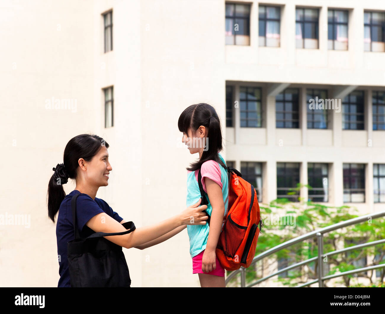 Mother and girl communication in the school Stock Photo - Alamy