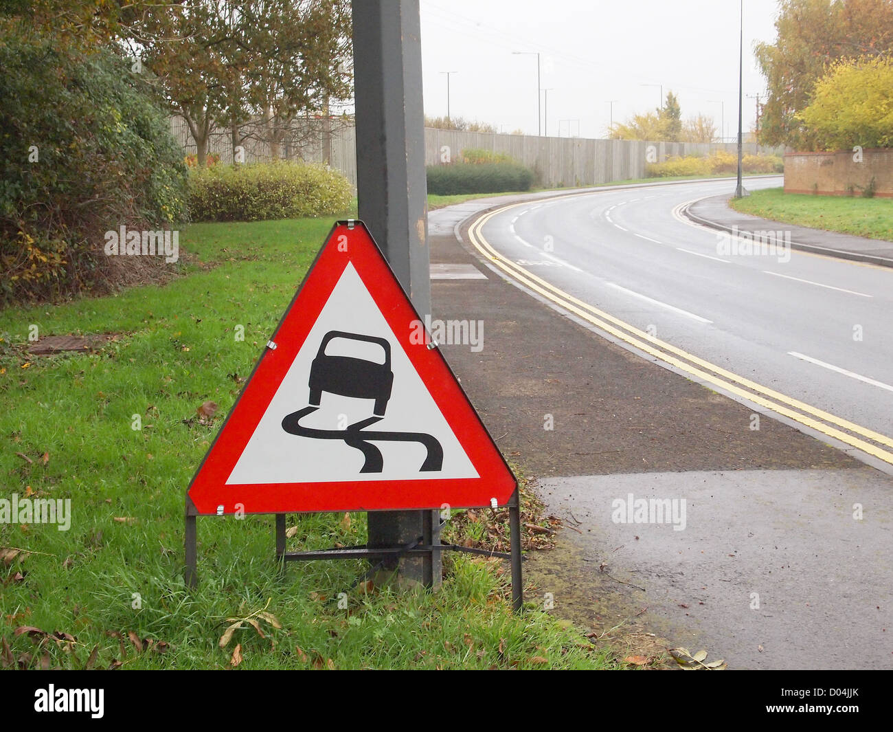 Slippery road ahead sign Stock Photo - Alamy