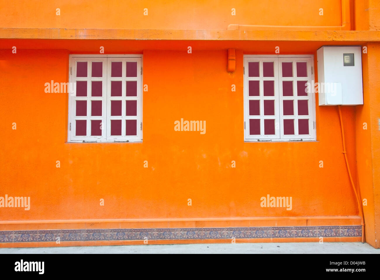 Vintage wall and windows in orange background Stock Photo - Alamy