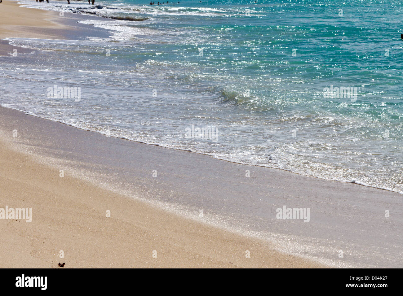 The ocean lapping on a Caribbean beach Stock Photo - Alamy