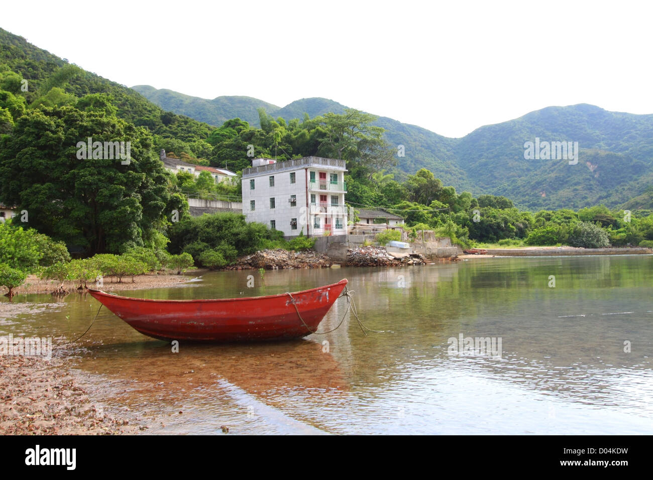 Isolated boat along the coast Stock Photo - Alamy