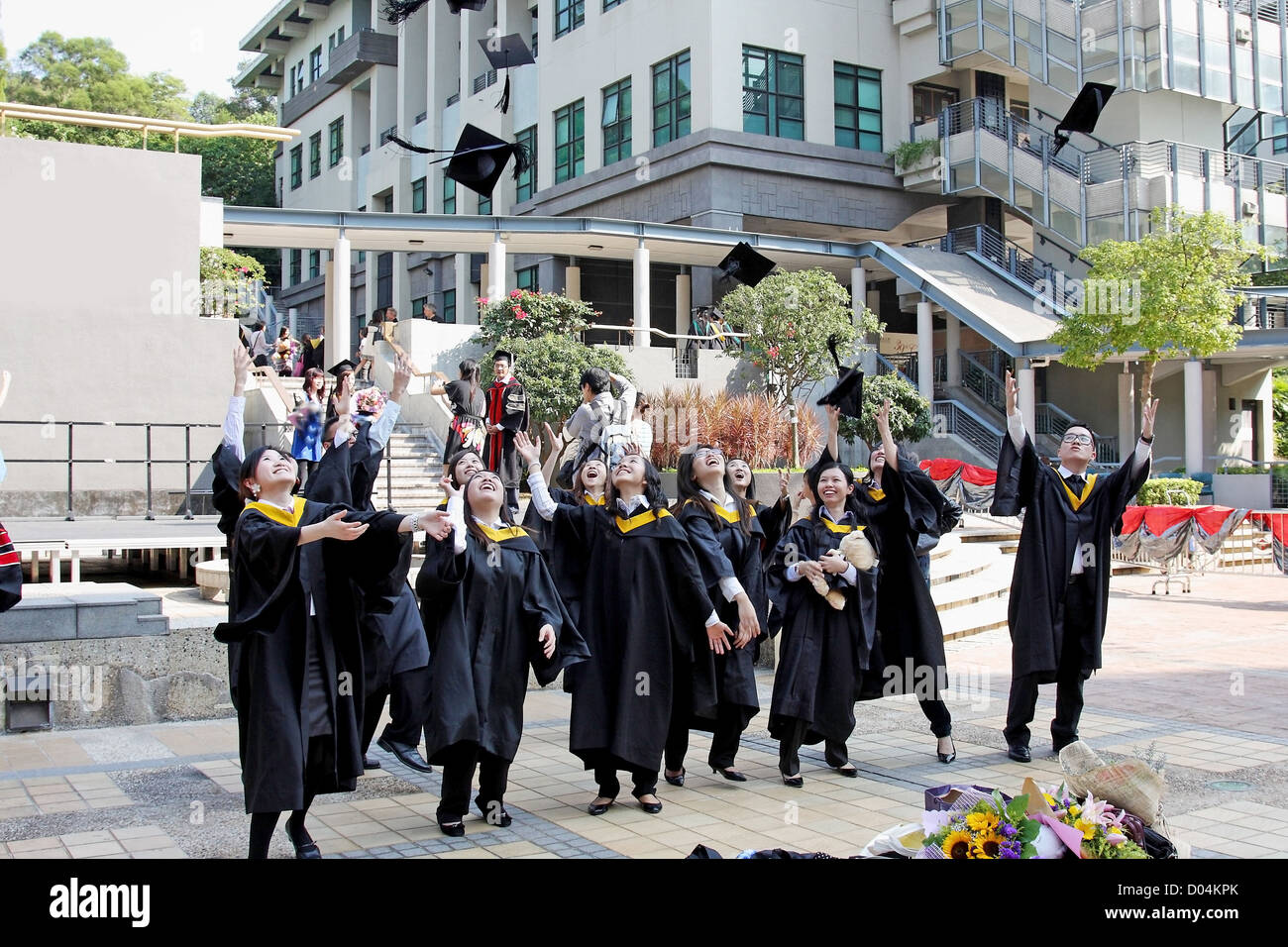 University students graduate with happiness Stock Photo - Alamy
