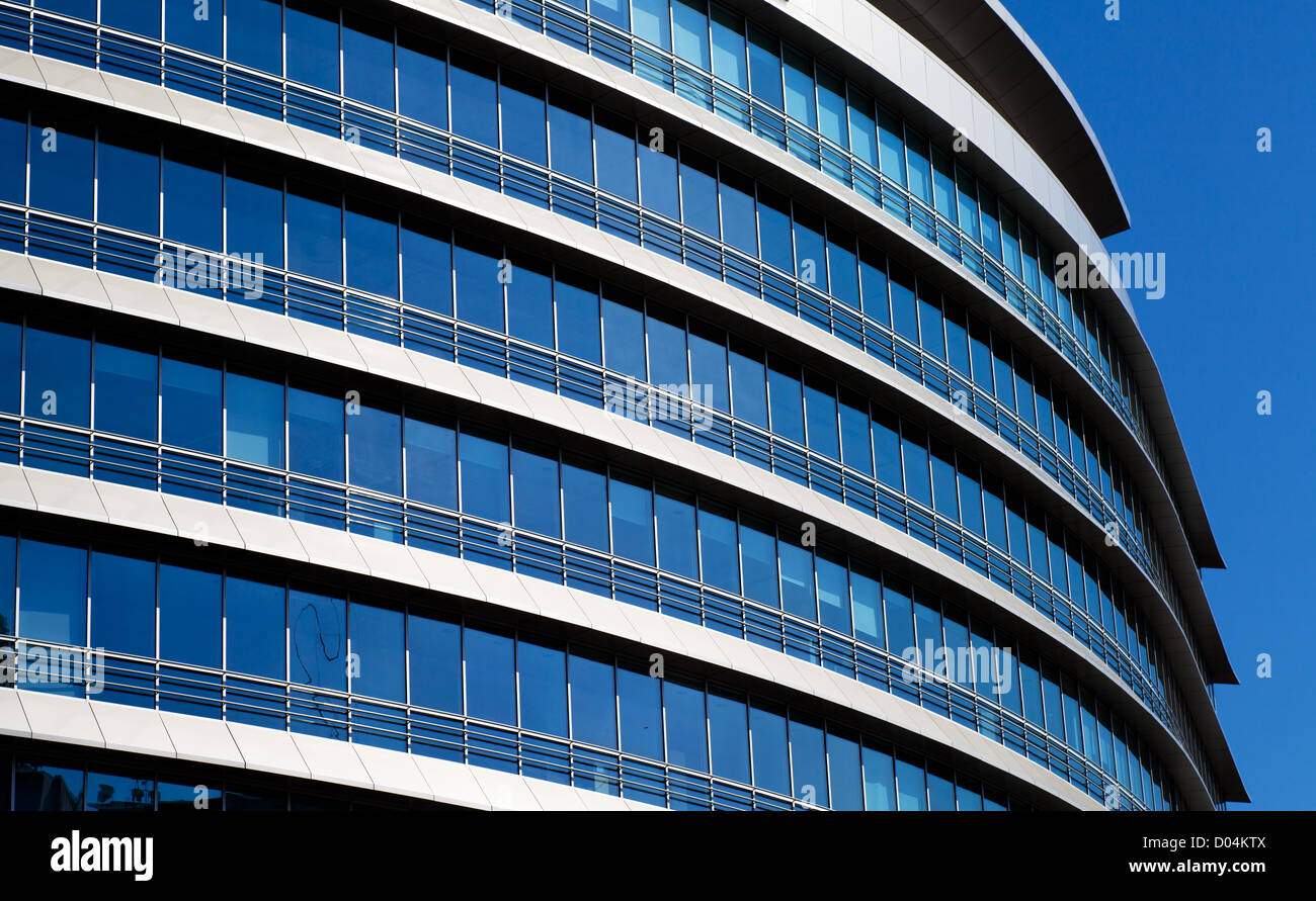 Windows of contemporary business tower over sky background Stock Photo ...