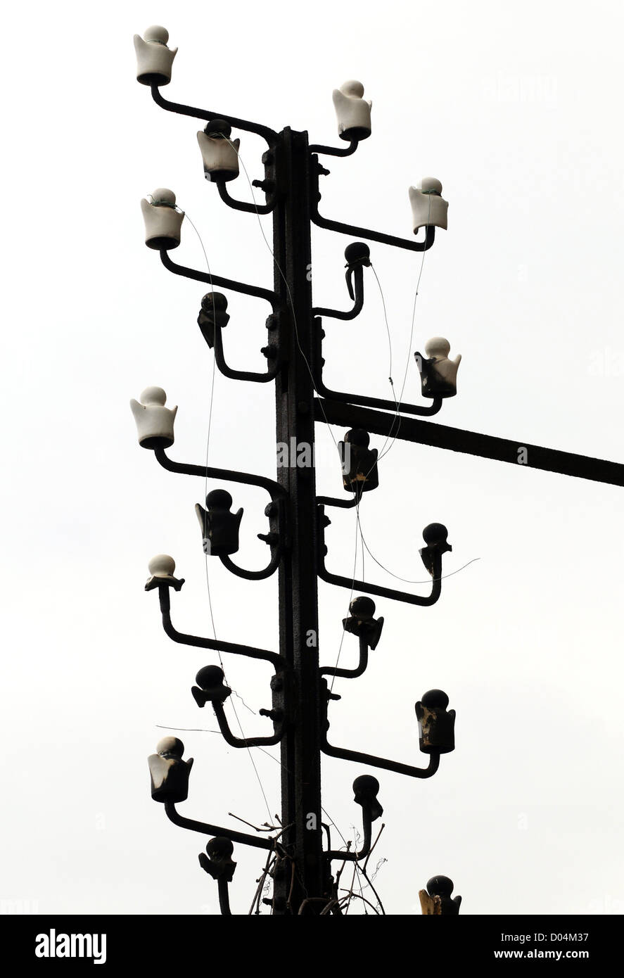 an old rusty pole with white insulators Stock Photo - Alamy