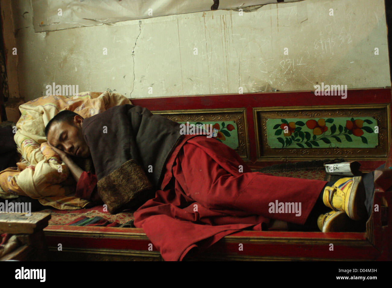 Lama sleeping in Ganzi Temple, Ganzi, NW Sichuan Stock Photo - Alamy