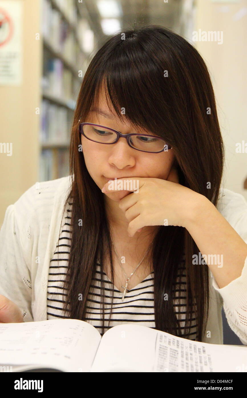 Asian girl student in library Stock Photo - Alamy