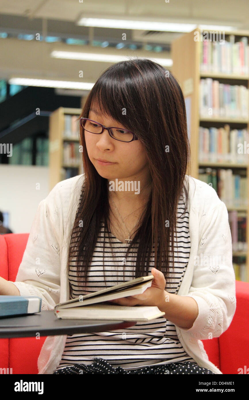 Asian girl student in library Stock Photo - Alamy