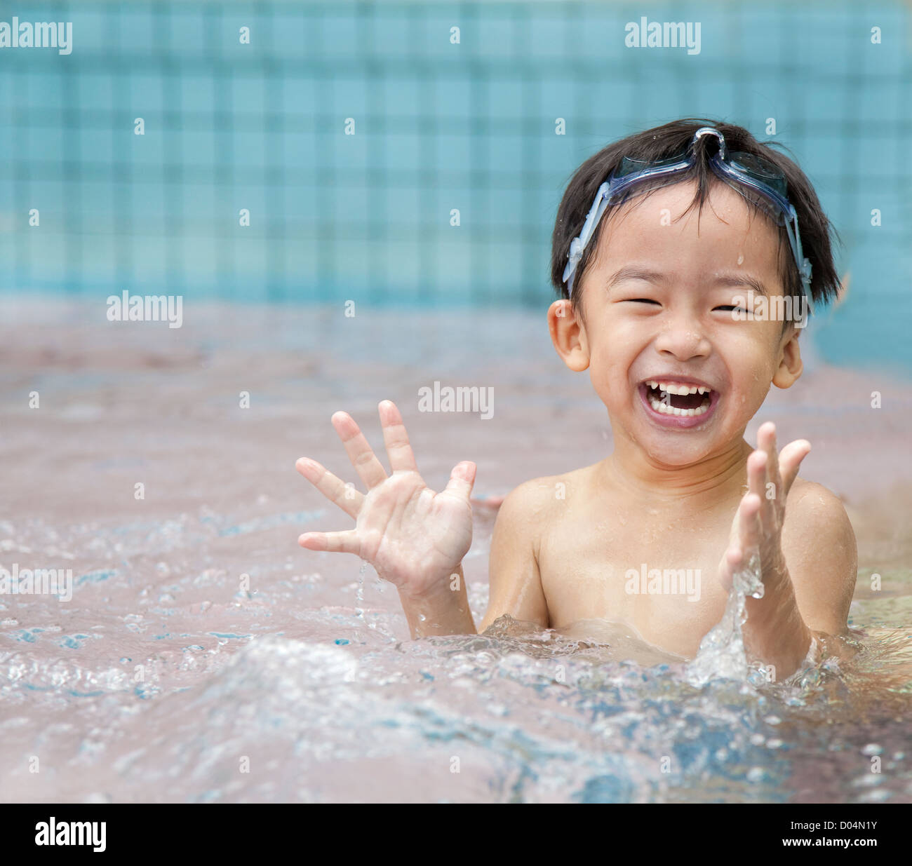 happy kid in the water Stock Photo - Alamy
