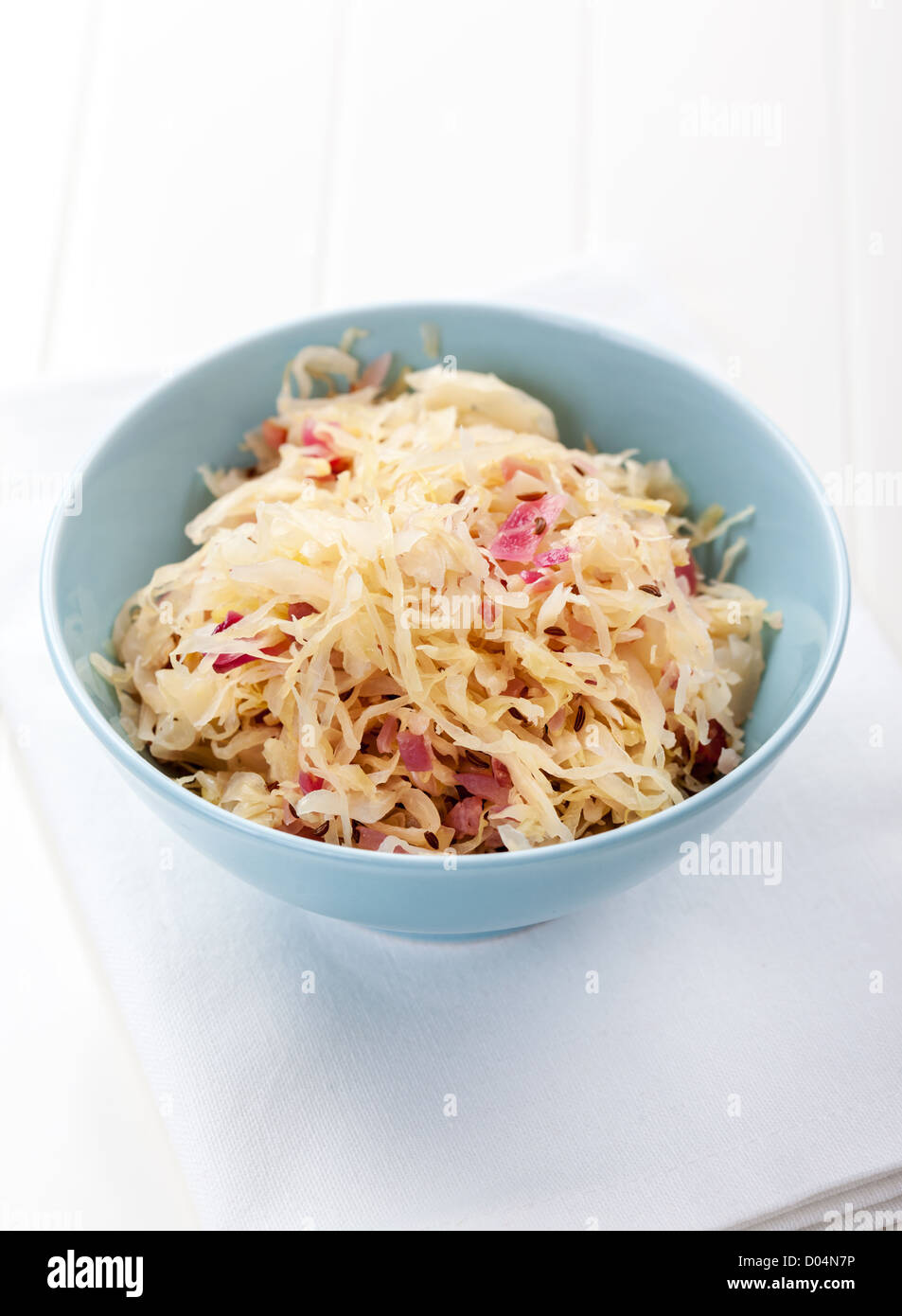 Sauerkraut - pickled cabbage in the bowl with onion Stock Photo - Alamy