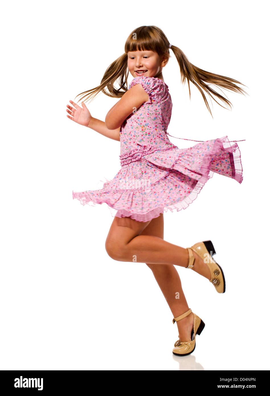 Cheerful girl dancing on floor isolated on white Stock Photo - Alamy