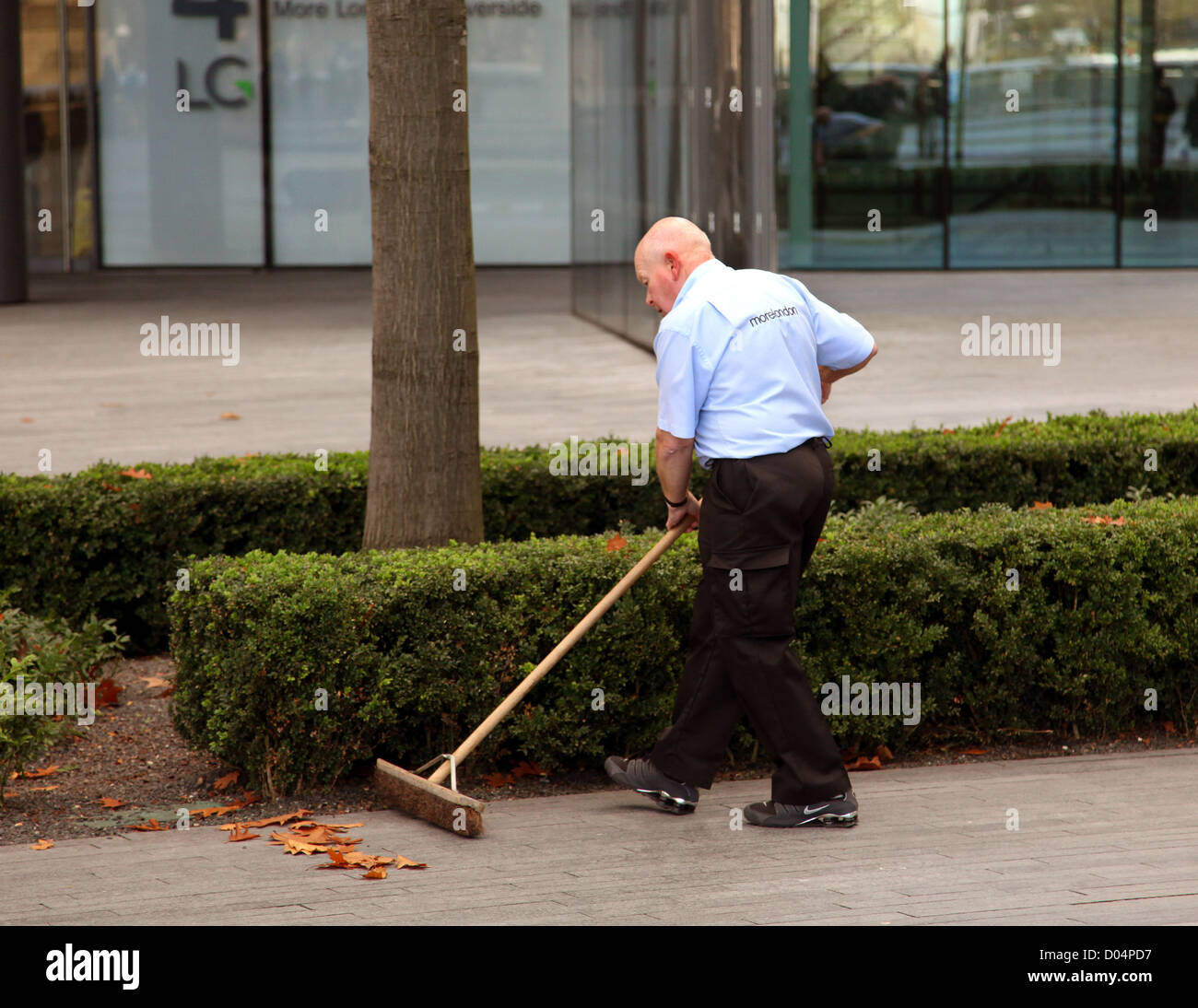 Street sweeper keeping London tidy Stock Photo - Alamy
