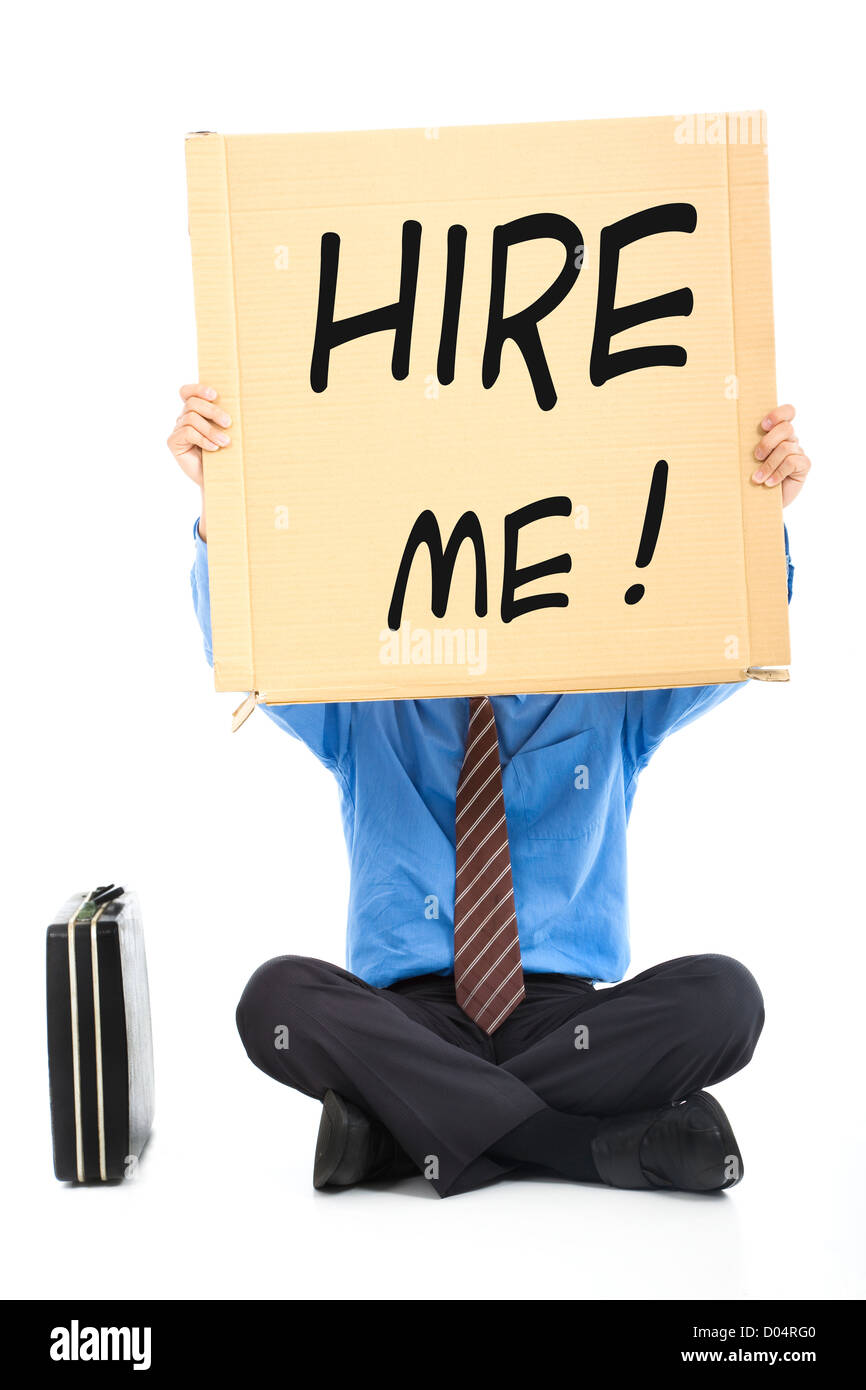 Businessman holding the text Hire Me Stock Photo - Alamy