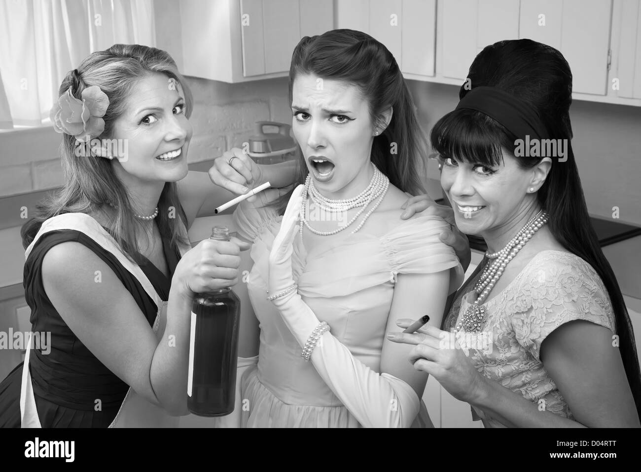 Young woman with her friends smoking and drinking in the kitchen Stock ...